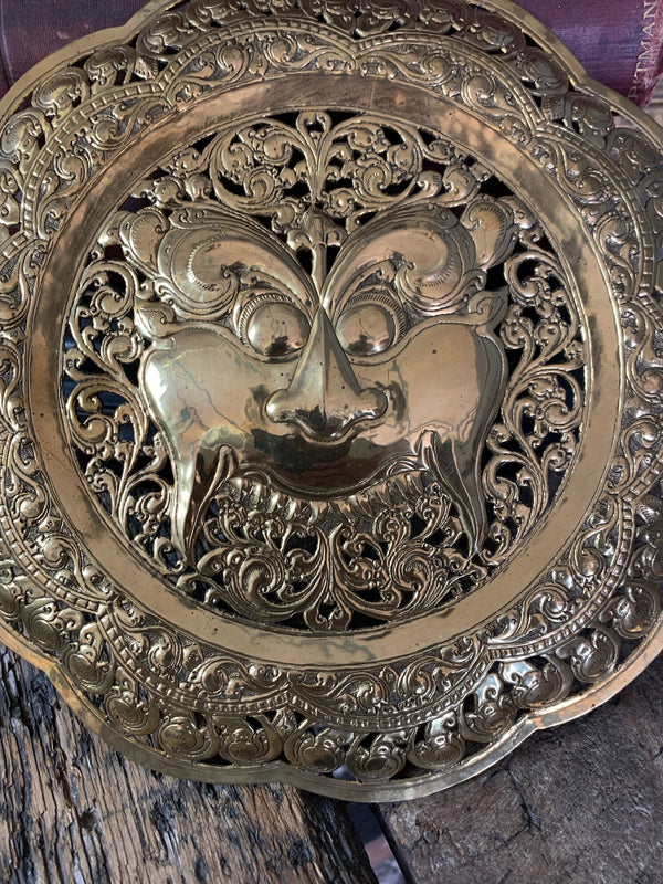 A pierced metal plaque depicting a devil or demon - Belle and Beast ...