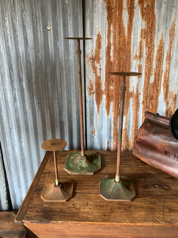 A trio of metal Art Deco shop display stands - Belle and Beast Emporium