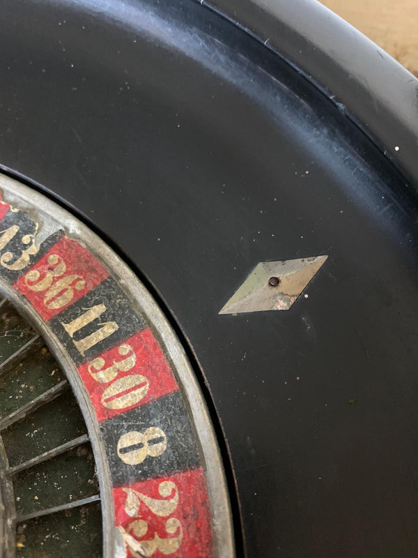 An ebonised wooden roulette wheel and green baize mat by Jaques of Lon ...