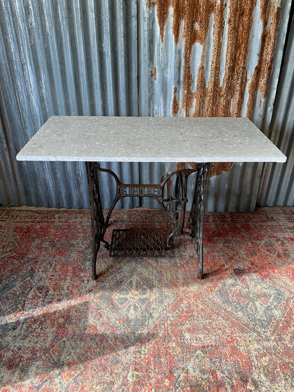 A cast iron Singer sewing table with marble top - Belle and Beast Emporium
