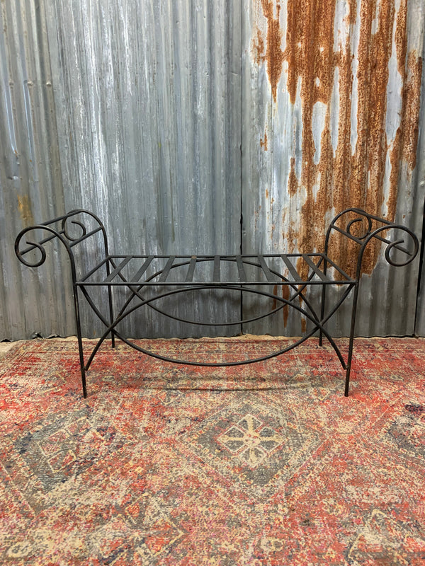 A wrought iron strapwork bench with scrolled arms - Belle and Beast ...